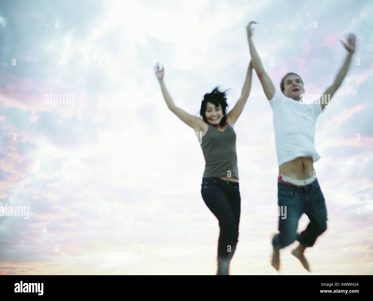 Man and woman jumping, portrait Stock Photo - Alamy