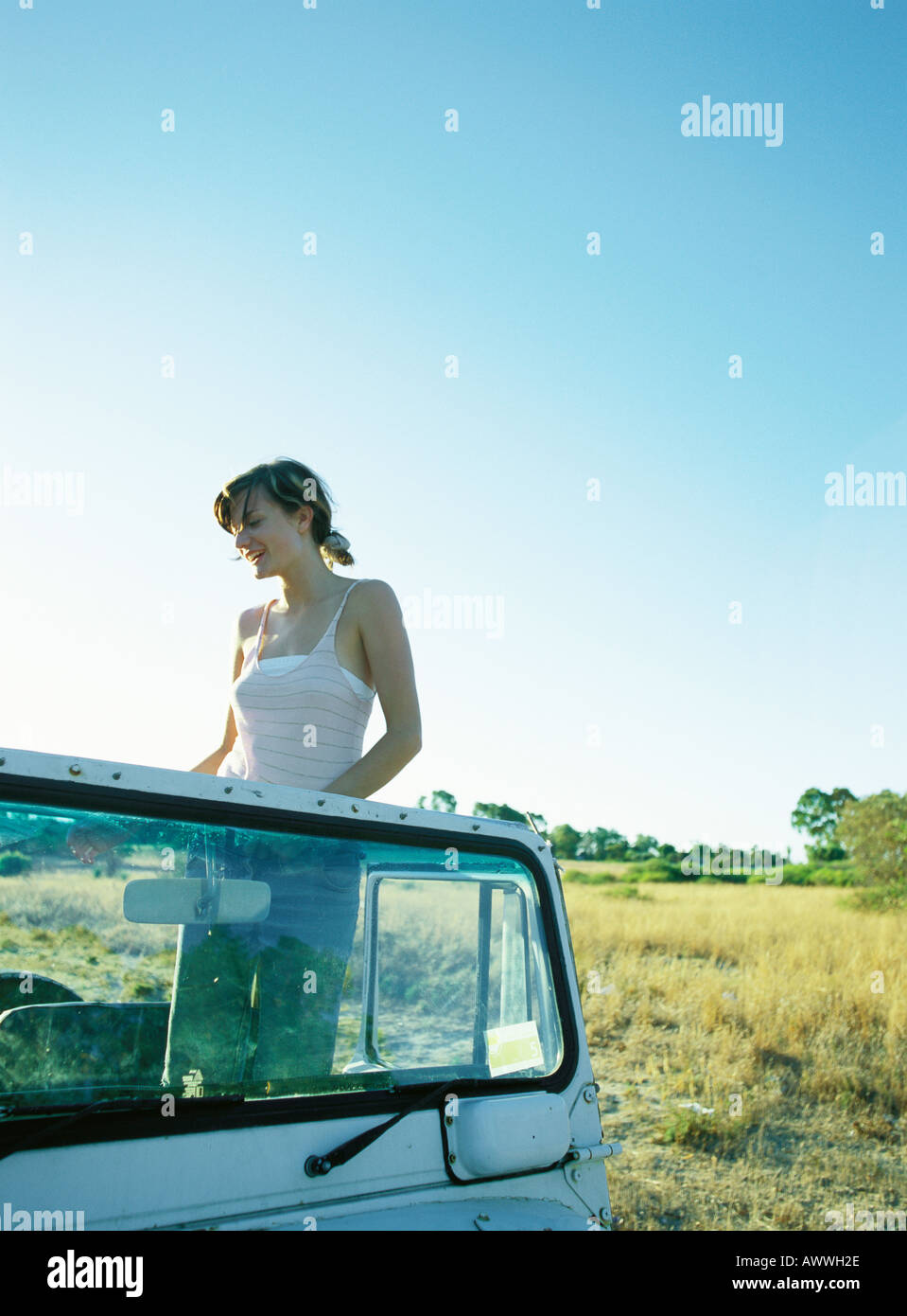 Woman standing up in 4x4 vehicle Stock Photo - Alamy
