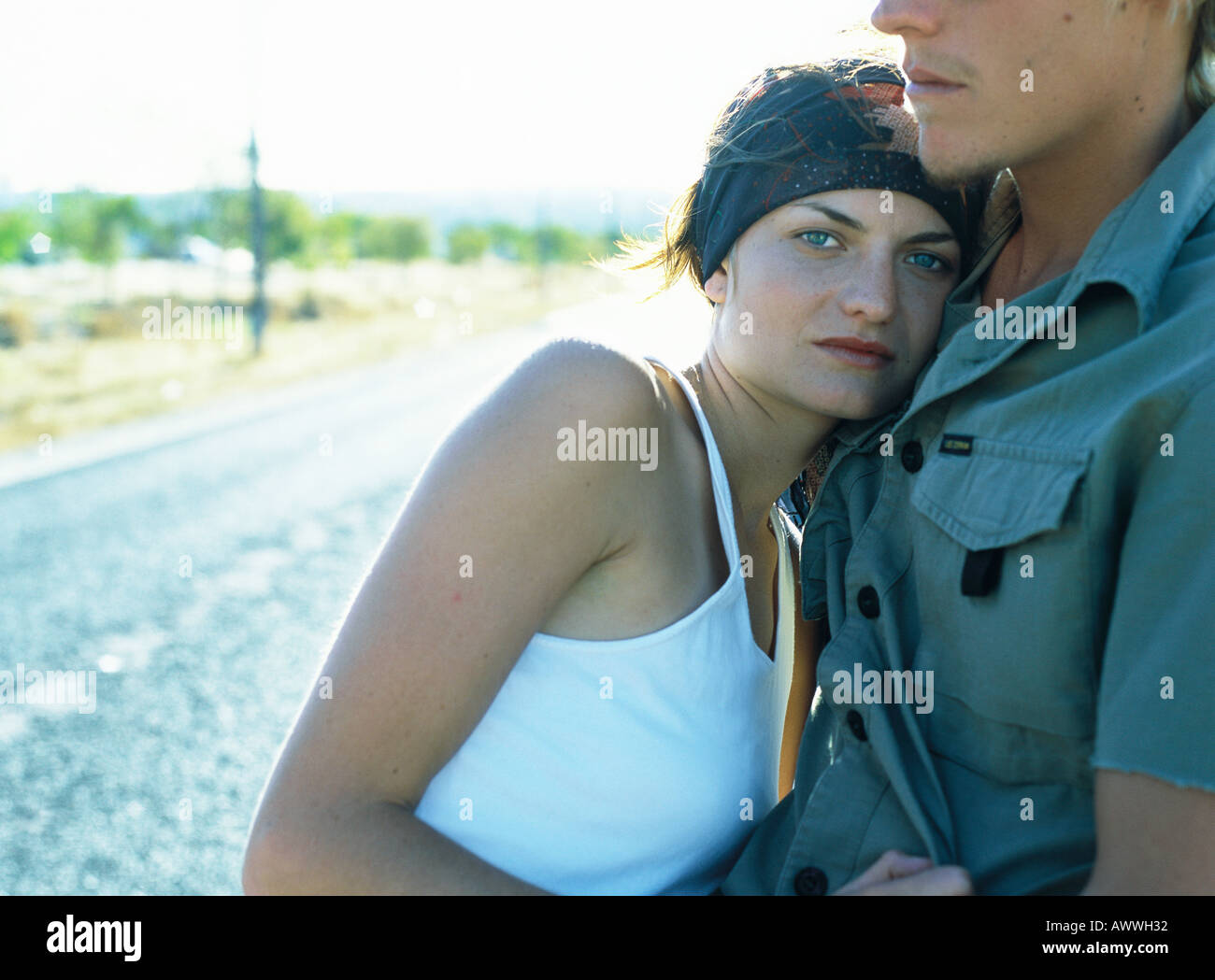 Couple hugging, woman looking at camera Stock Photo - Alamy