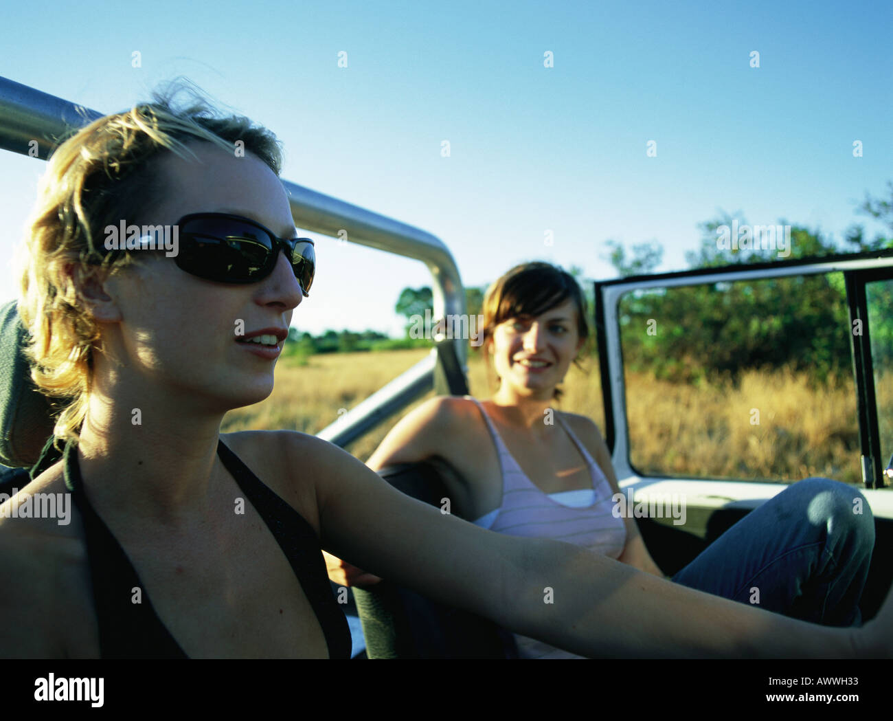 Two women in 4x4 vehicle Stock Photo - Alamy