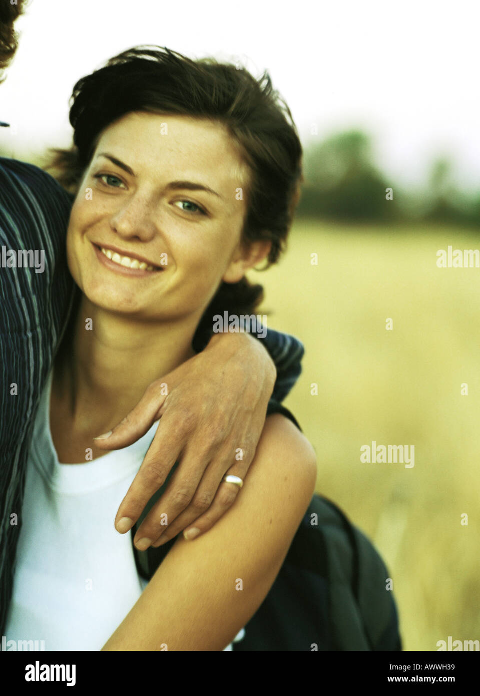Woman arm around mans shoulder hi-res stock photography and images - Alamy