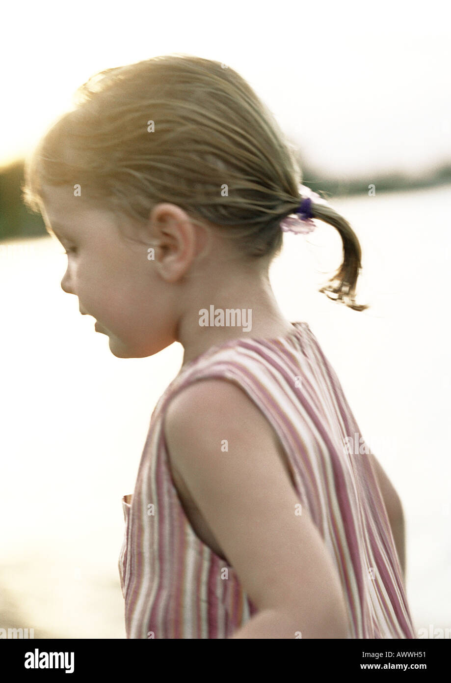 Girl with ponytail, side view Stock Photo - Alamy