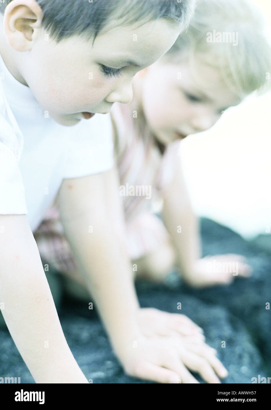 Children on rock, close-up Stock Photo - Alamy