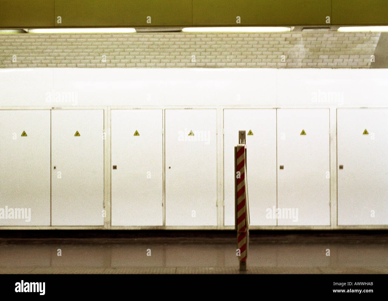 Row of doors enclosing electrical equipment in subway station Stock ...