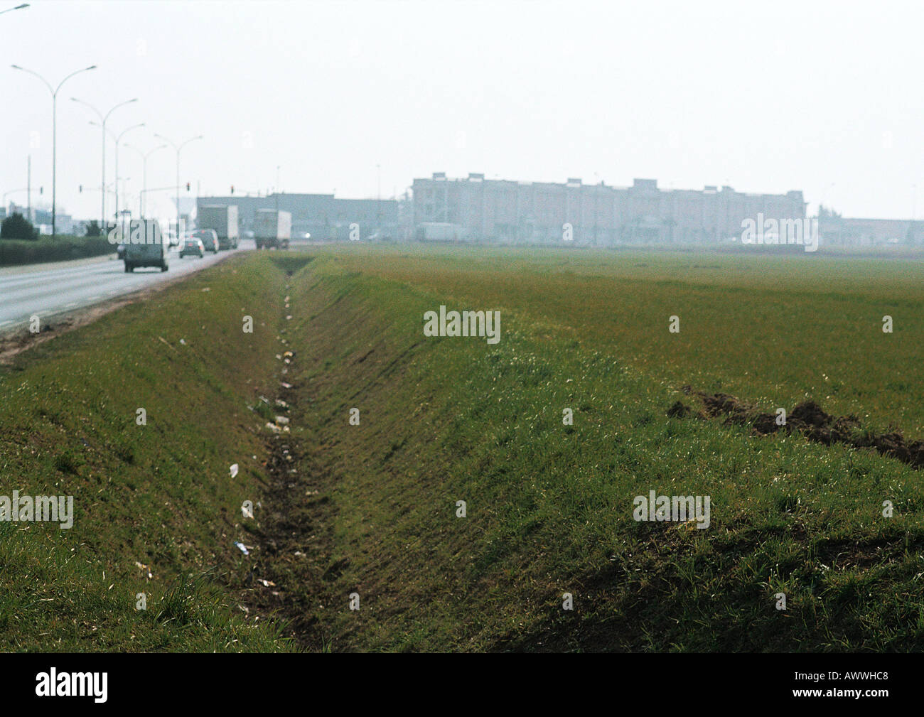 Littered ditch along road Stock Photo - Alamy