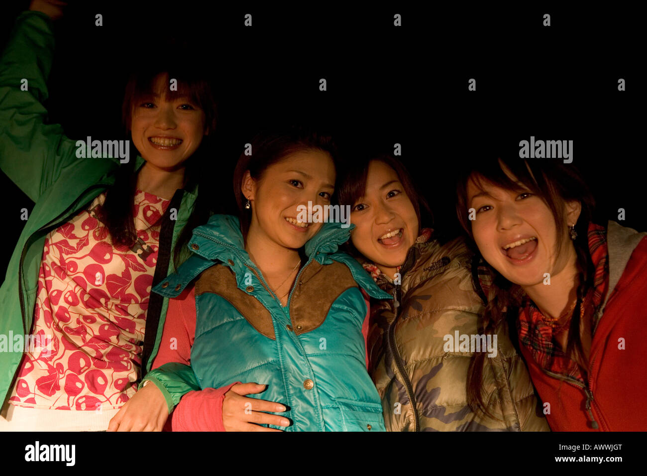 Friends singing at night Stock Photo - Alamy