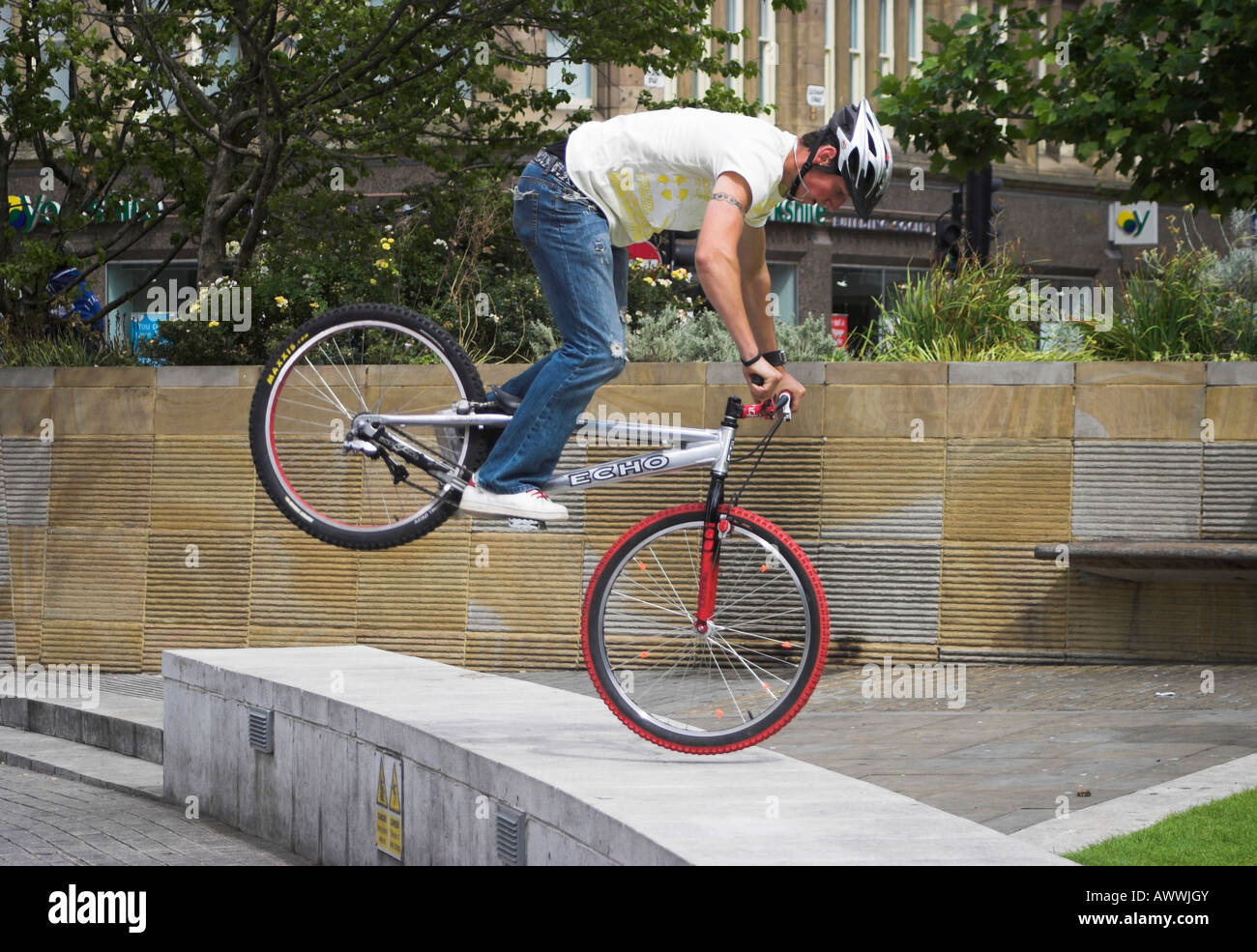 Balancing on one wheel. A cyclist performing tricks. . Piccadilly ...