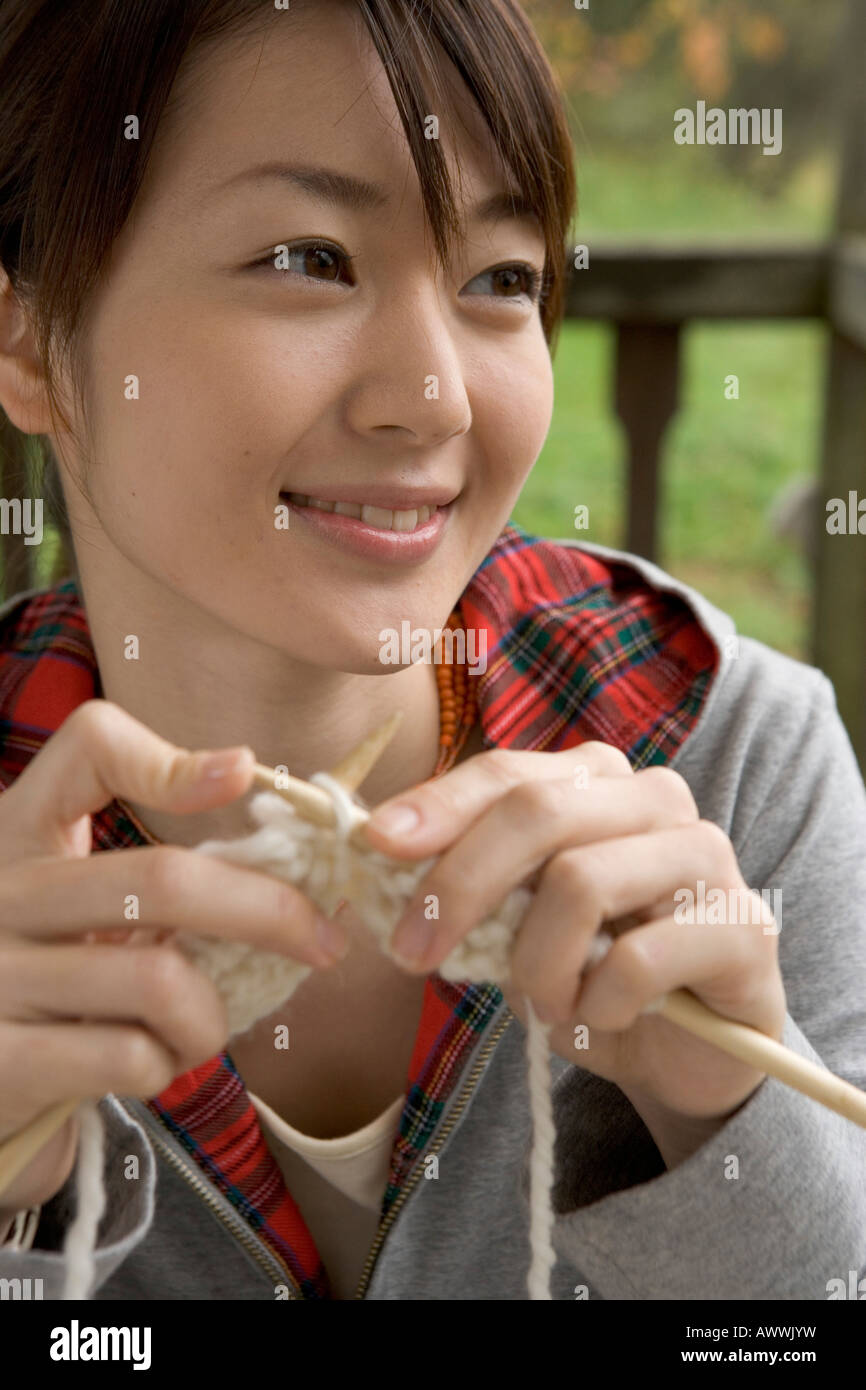 Young woman knitting Stock Photo - Alamy