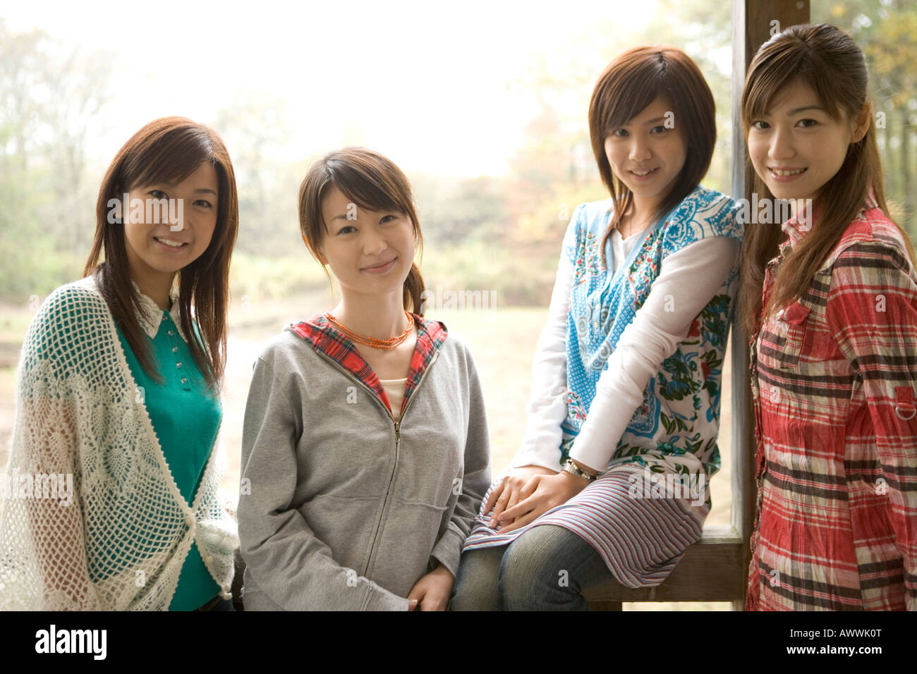 Portrait of four young women on porch Stock Photo - Alamy