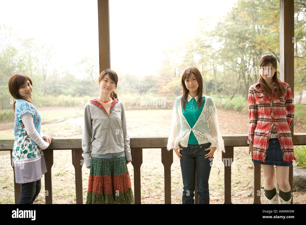 Portrait of four young women on porch Stock Photo - Alamy
