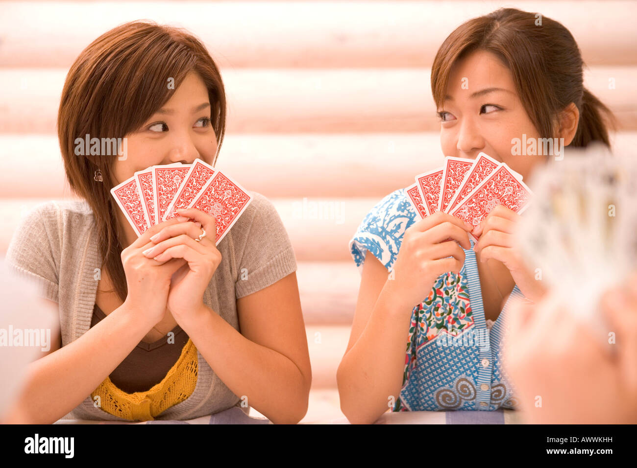 Women playing cards at table Stock Photo - Alamy
