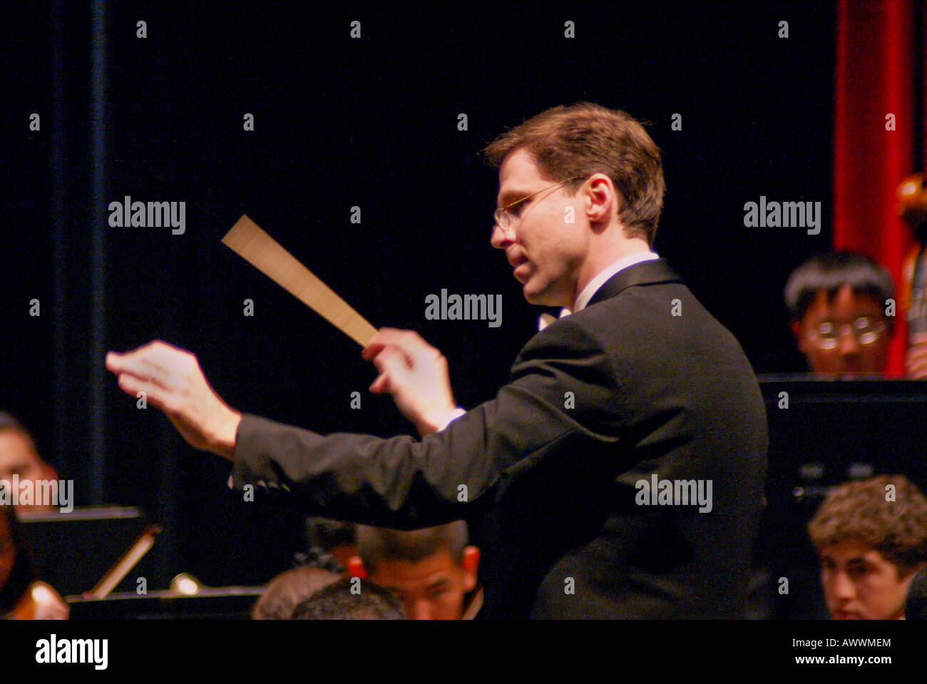 Conductor Michael Hall directs during performance by Pacific Symphony ...