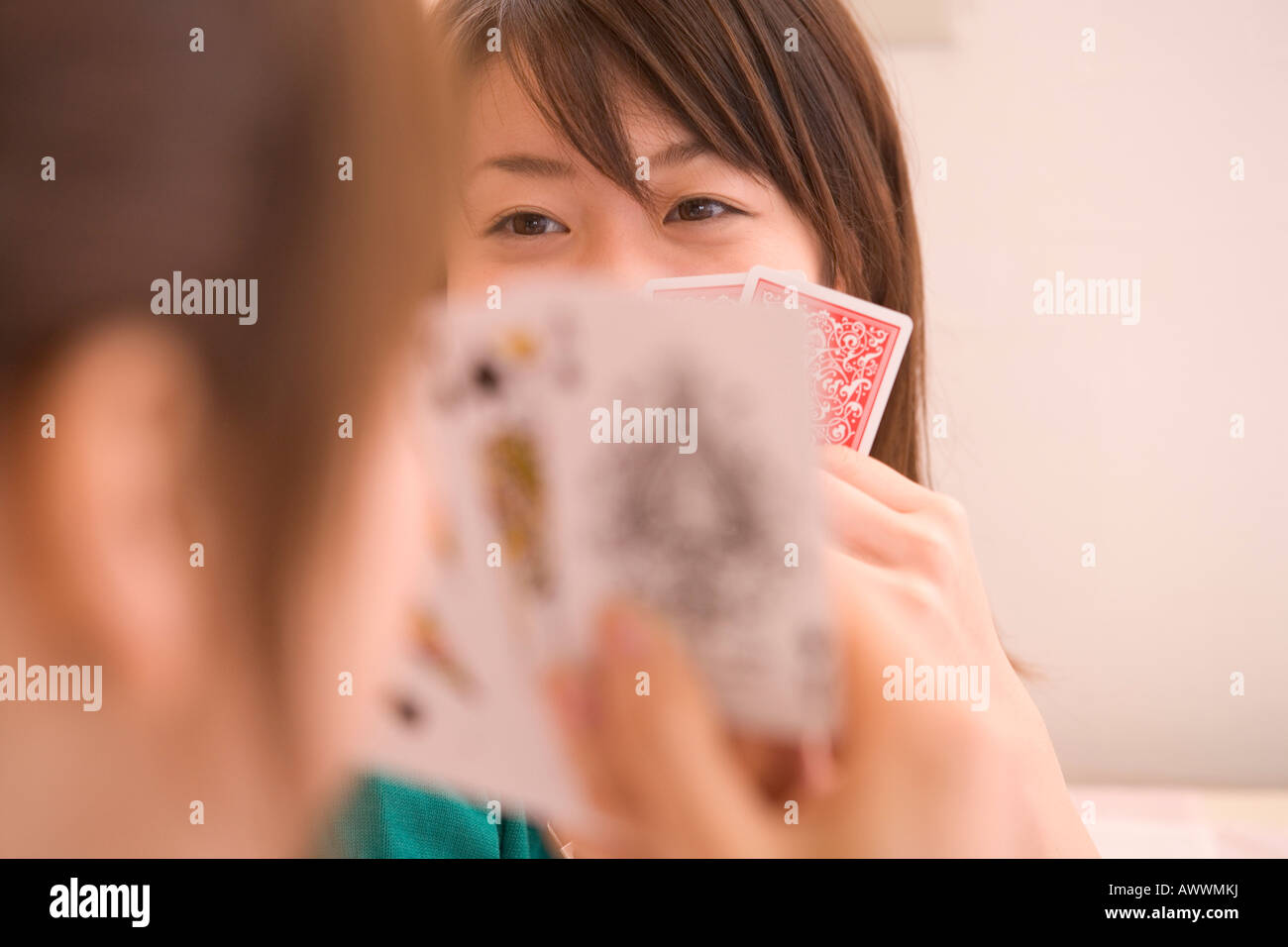Two women playing cards Stock Photo - Alamy