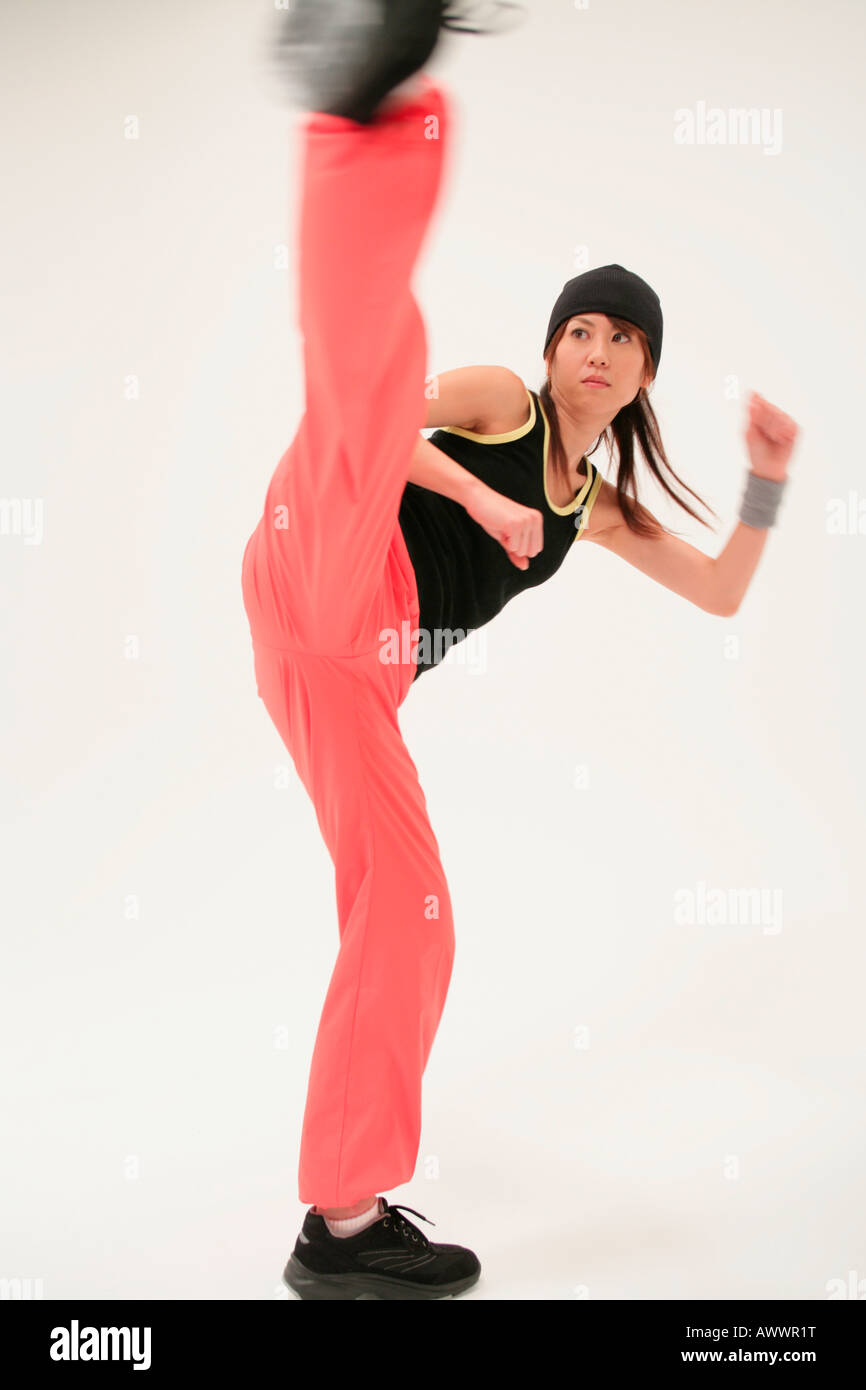 Young woman in fighting stance Stock Photo - Alamy