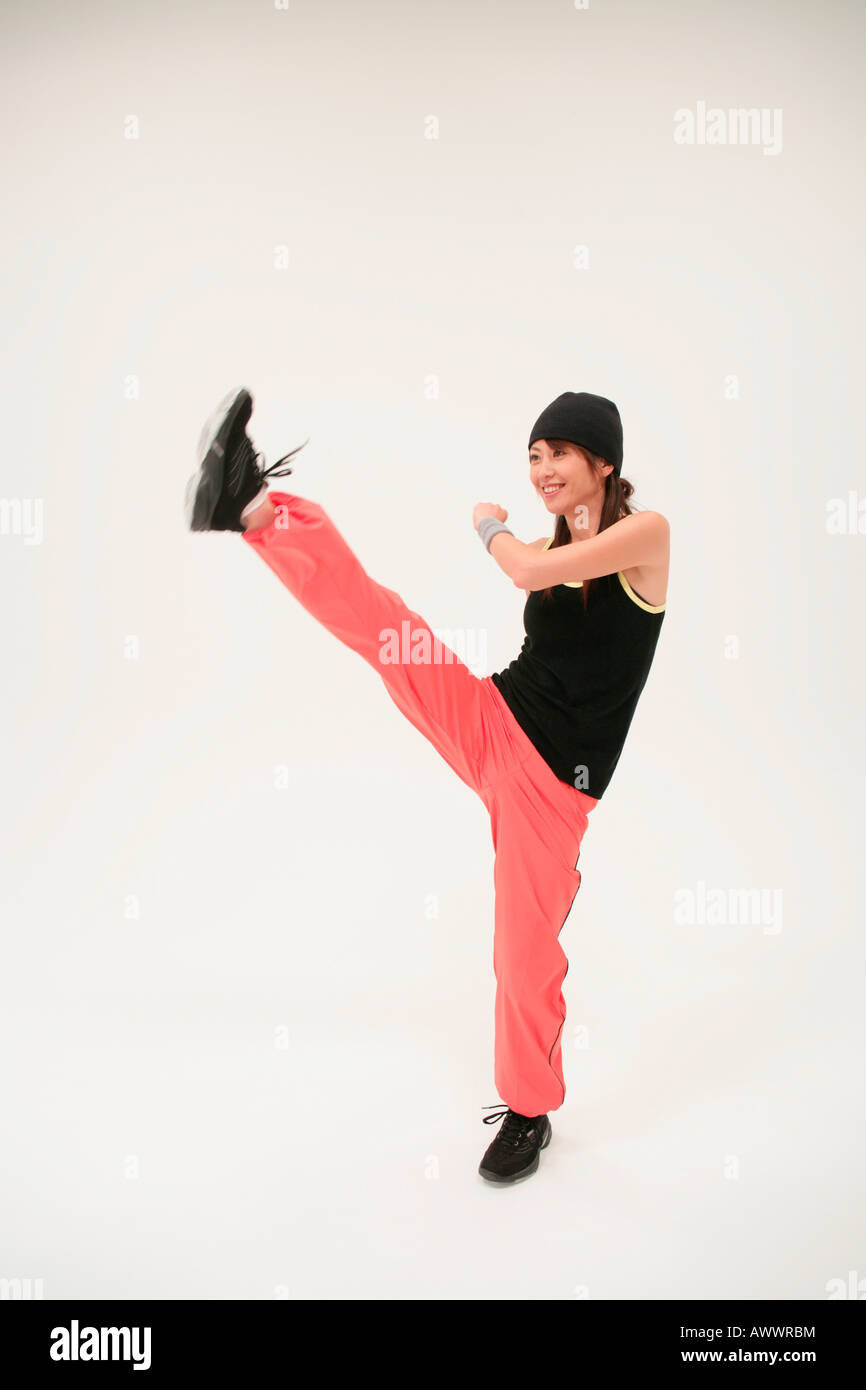 Woman kicking leg hi-res stock photography and images - Alamy