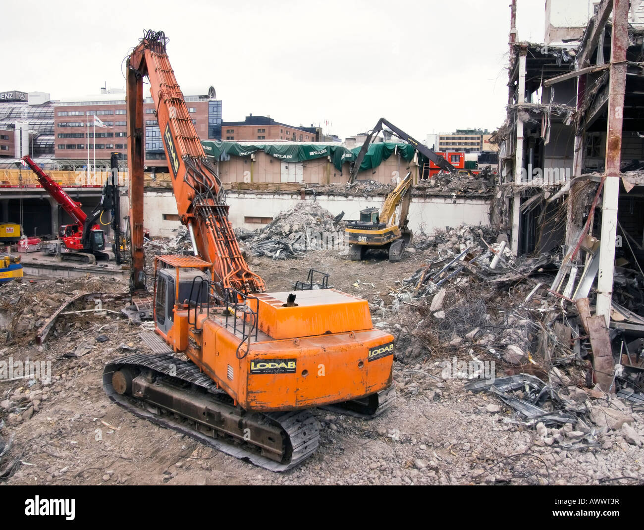 Excavator at demolition site Stock Photo - Alamy