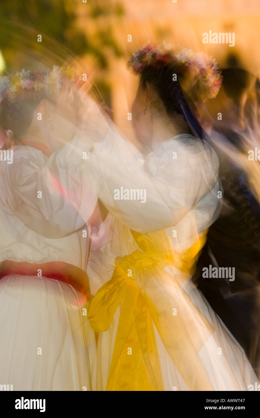 Two female Basque traditional dancers dance at night, Arenal Bilbao ...