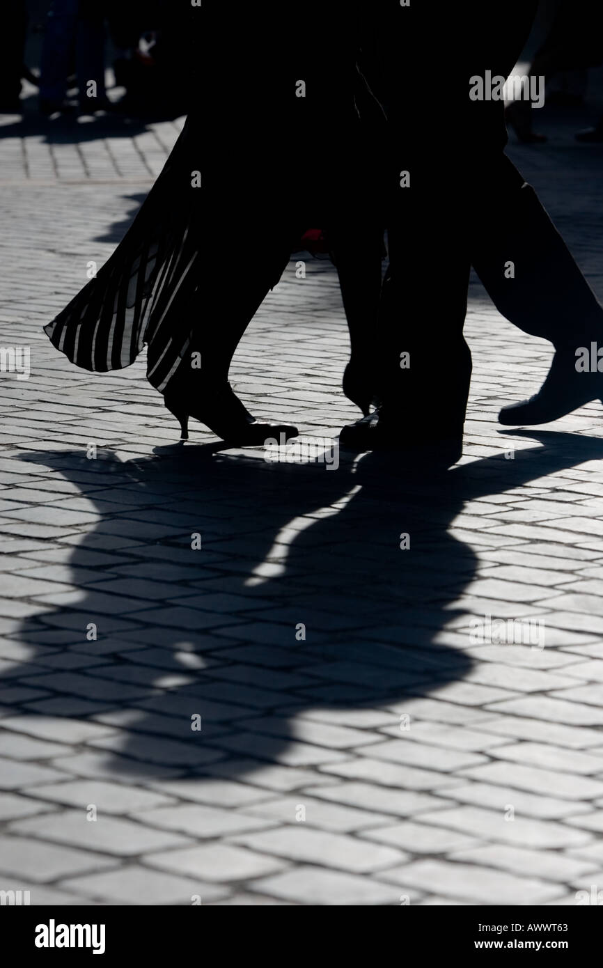 Silhouettes and shadows of two Spanish dancers demonstrating the tango ...