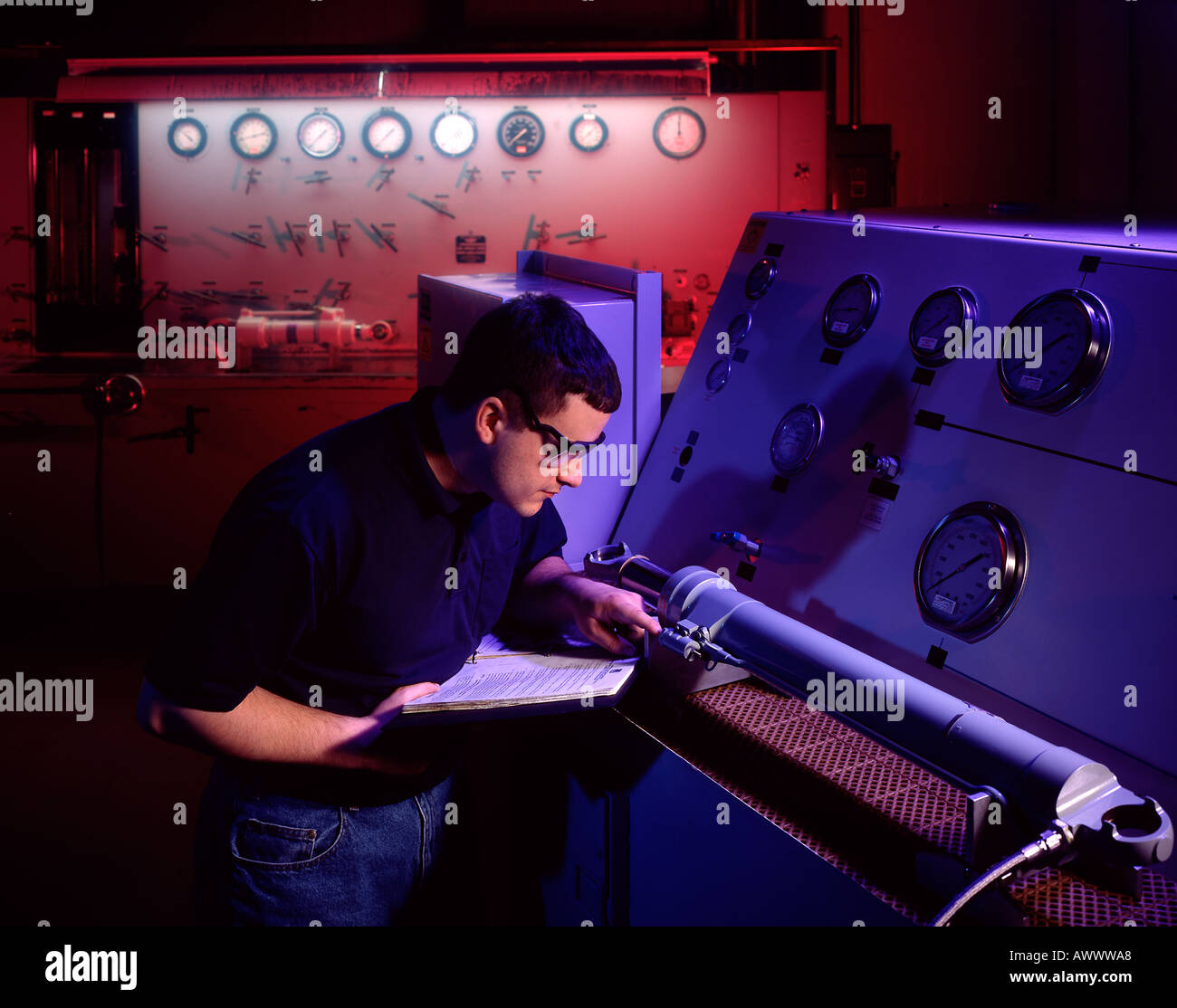 Industrial worker checks accuracy of landing gear equipment Stock Photo ...