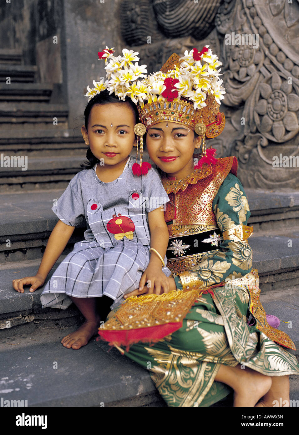 Child Legong dancer with her sister at temple Denpasar, Bali, Indonesia ...