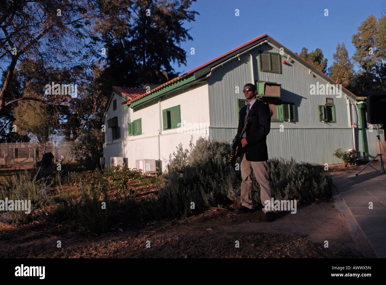 A "Shabak" security man armed with rifle stands guard during visit of ...