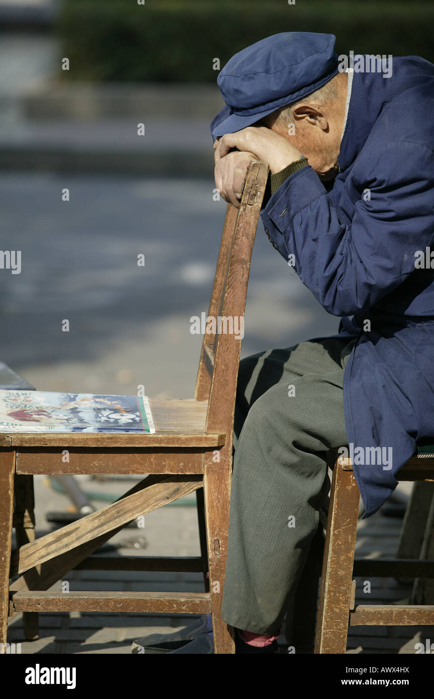Old man sleeping on chair hi-res stock photography and images - Alamy