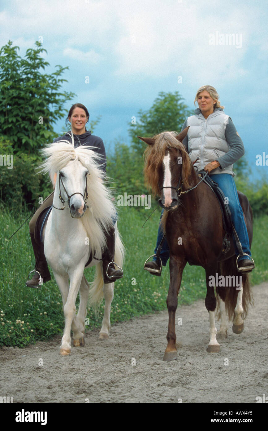 two women horse riding Stock Photo - Alamy