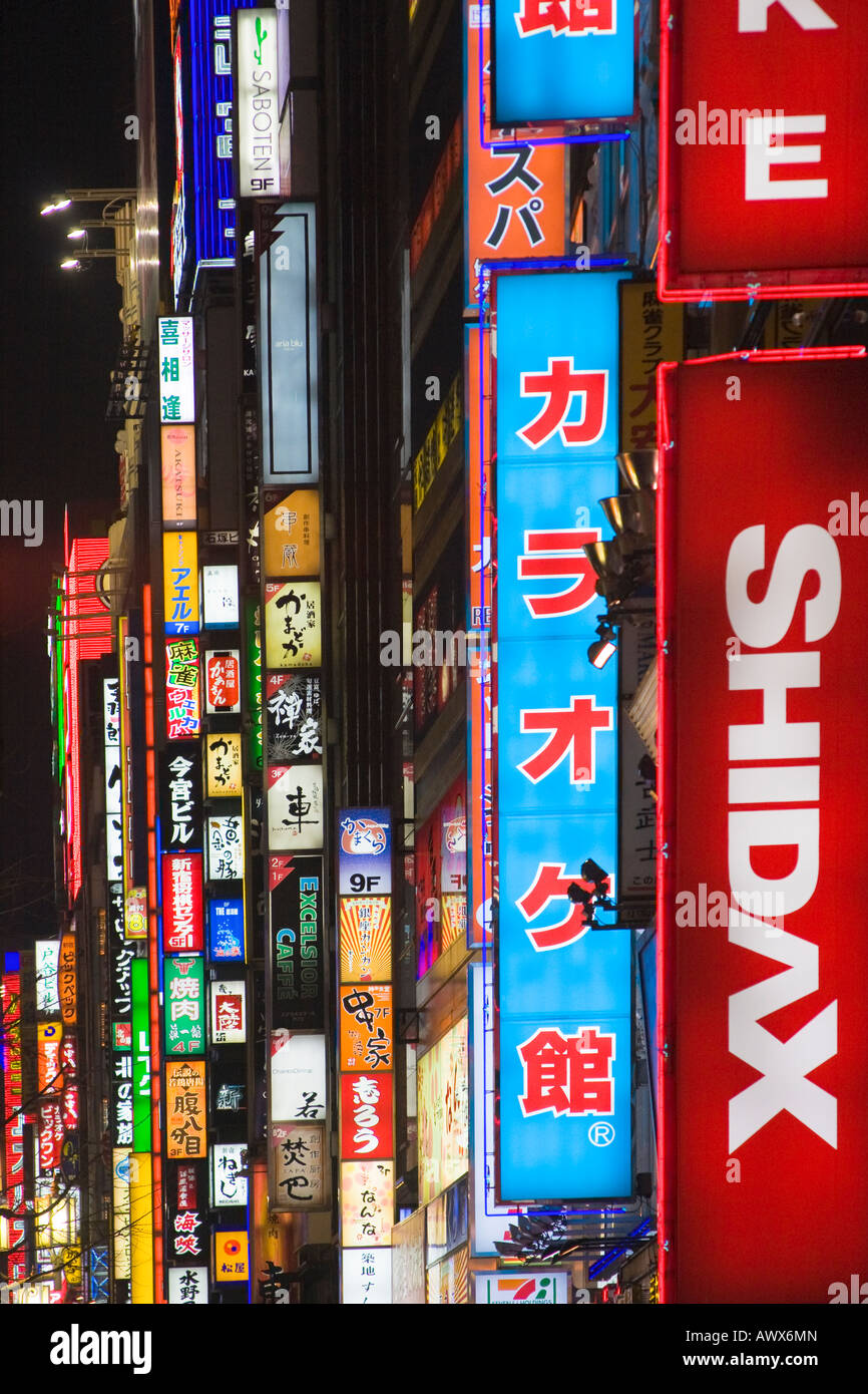 Many vertical Japanese signs glowing at night Stock Photo - Alamy