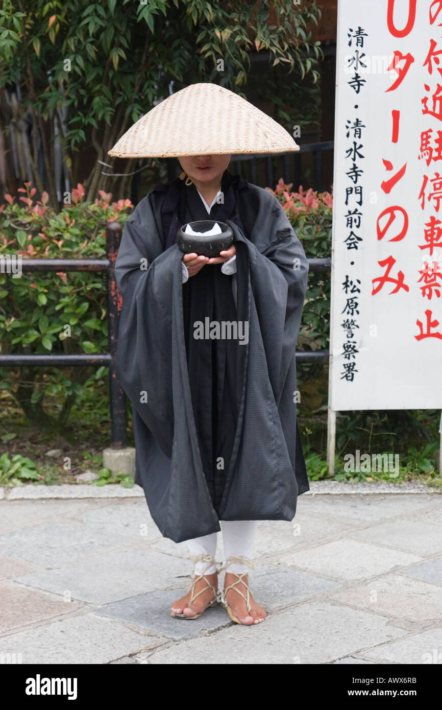Japanese Buddhist monk collecting alms near Kiyomizudera Temple in the ...