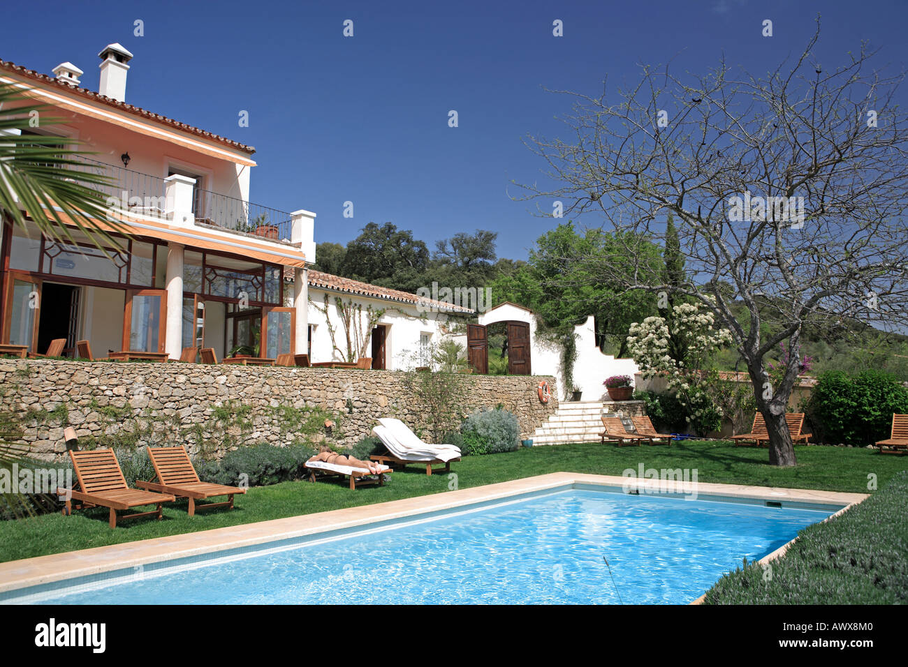 Large rustic hotel and swimming pool set in beautiful gardens in the ...