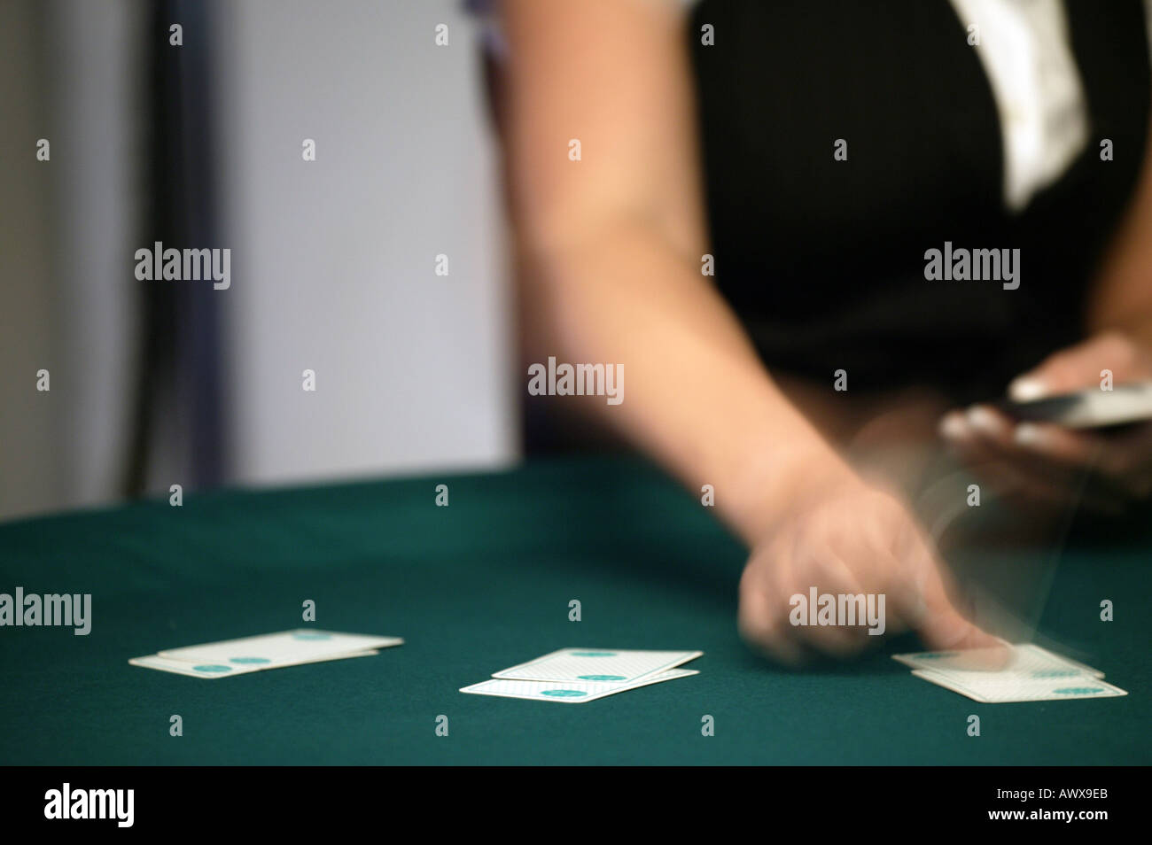 Dealing cards in motion Stock Photo - Alamy