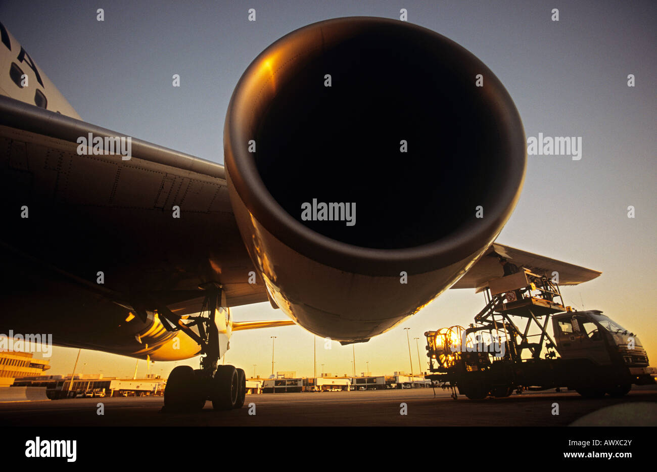 Close-up on jet engine at sunset Stock Photo - Alamy
