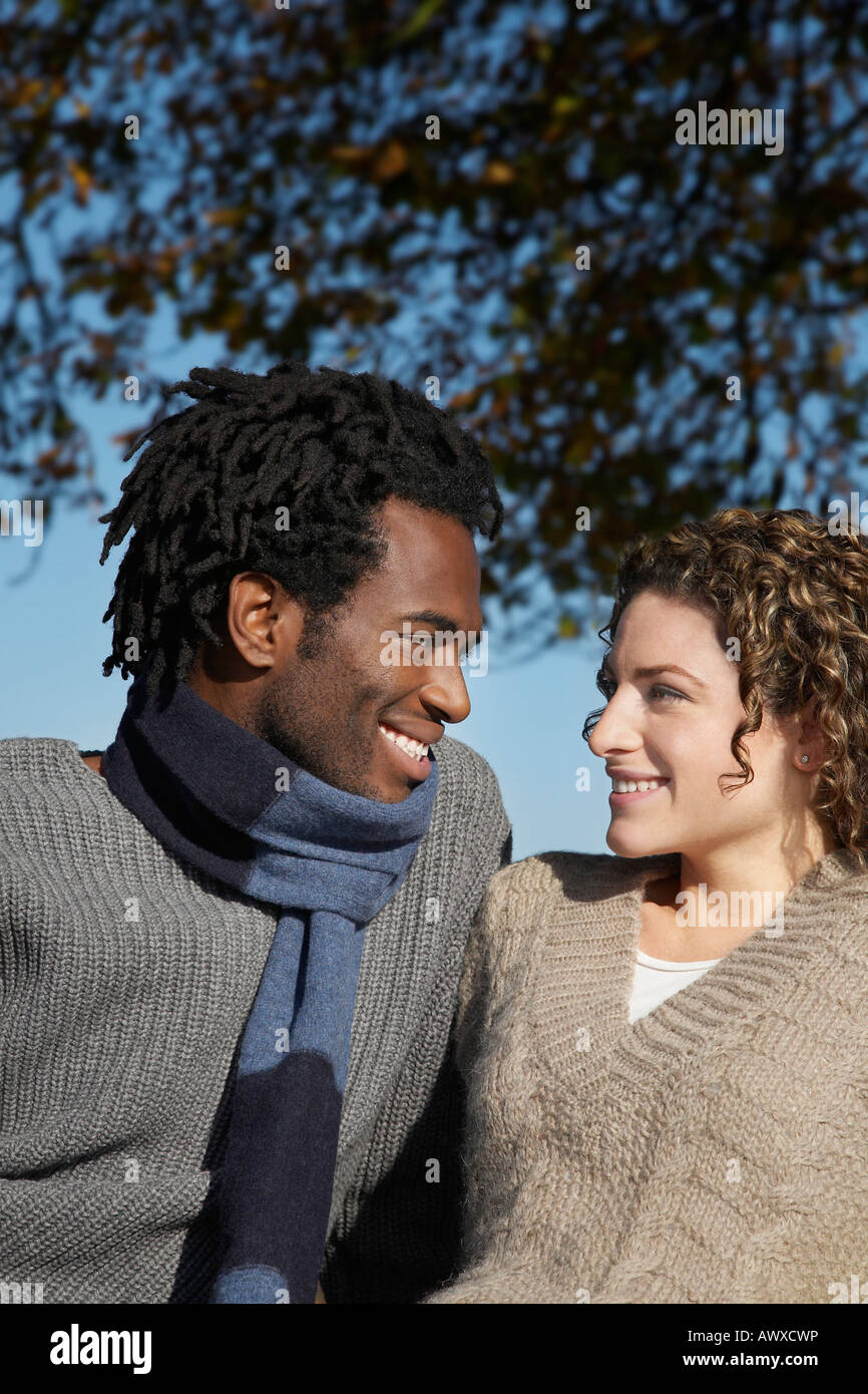 Couple outdoors, looking in eyes Stock Photo - Alamy