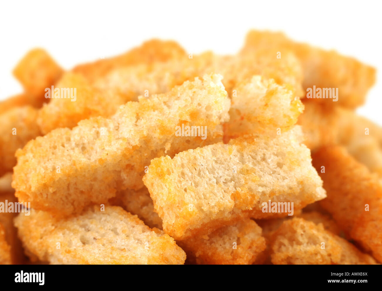 Yellow crouton fried bread slice closeup background Stock Photo - Alamy