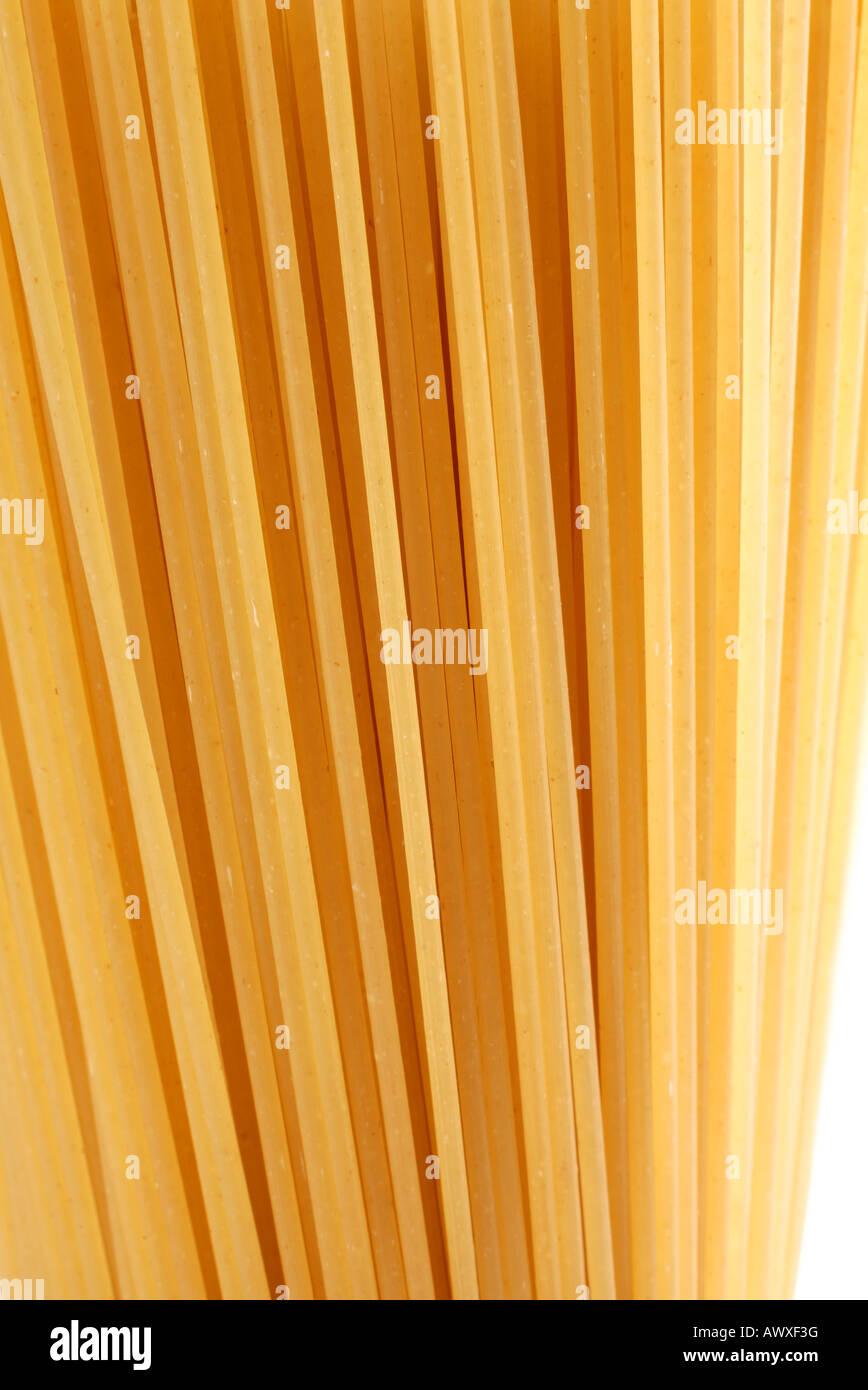 Yellow long pasta detail view background Stock Photo - Alamy