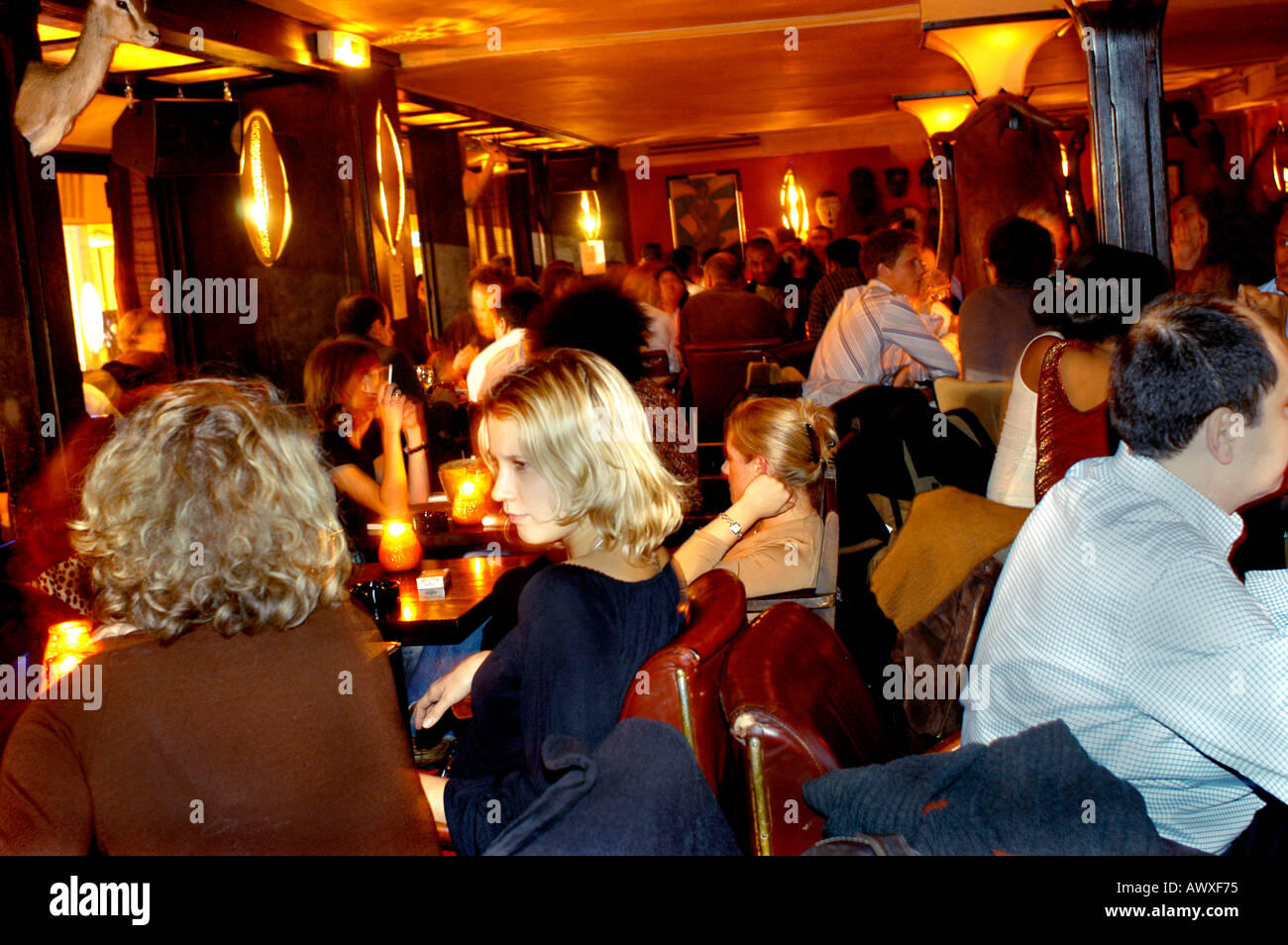 PARIS France, Crowd of People, Women in Dining Room, Af-rican Theme Bar ...