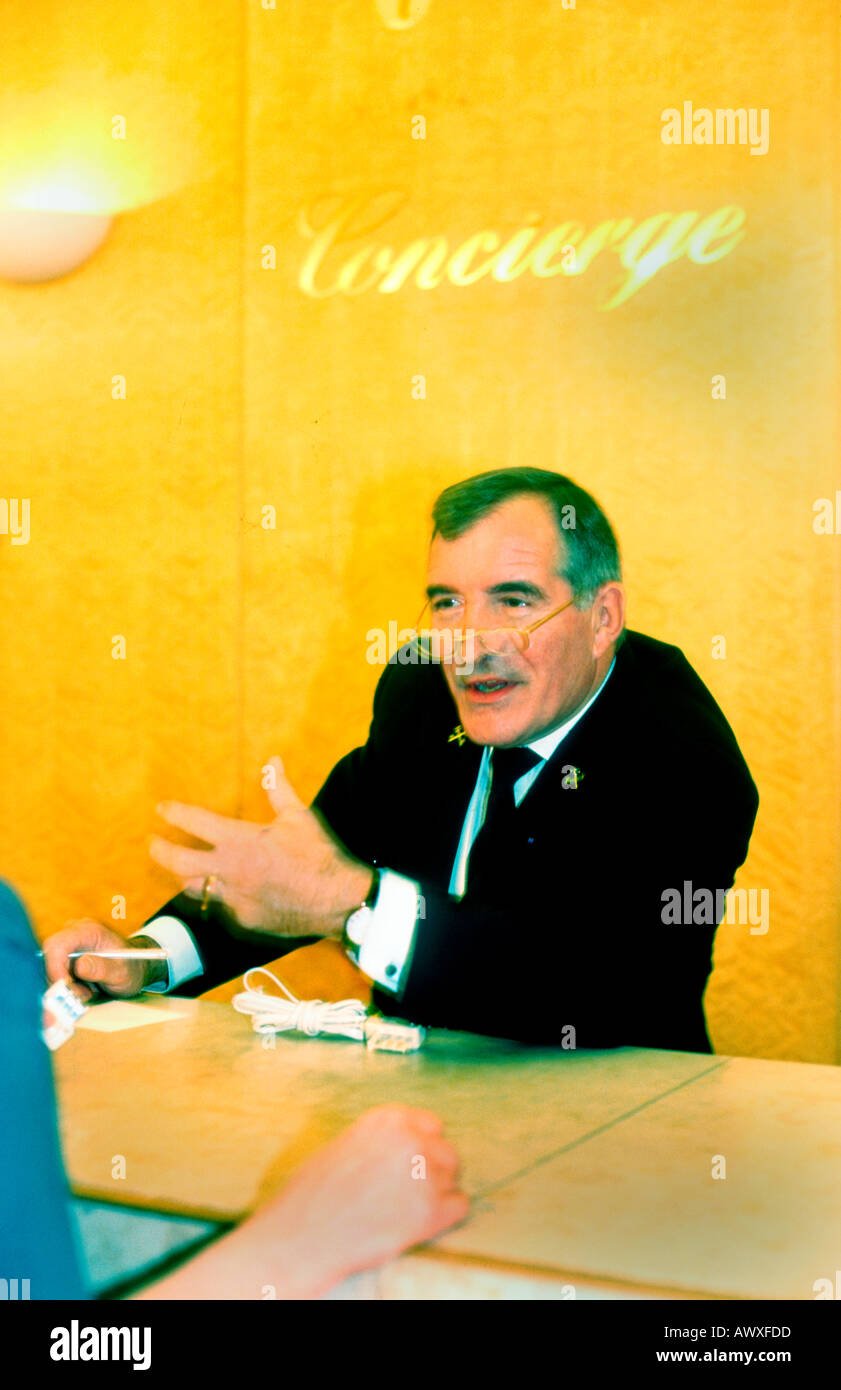 Paris France, Concierge Helping a Client in a Large Luxury "Hotel ...