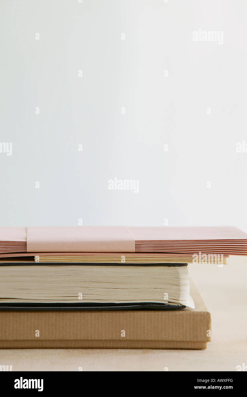 Stack of books and paper stationery, studio shot Stock Photo - Alamy