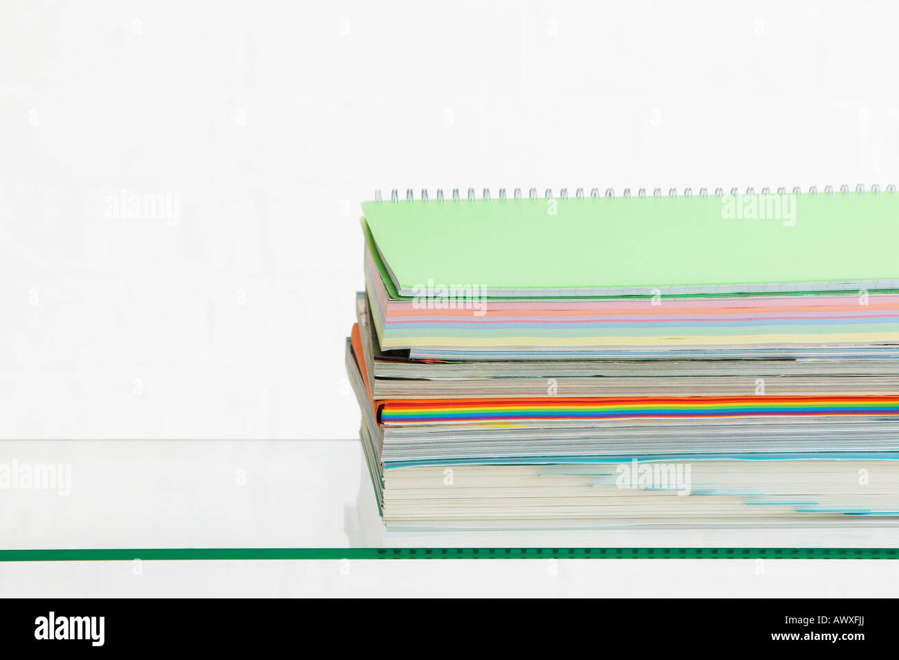 Stack of coloured stationery, studio shot Stock Photo - Alamy