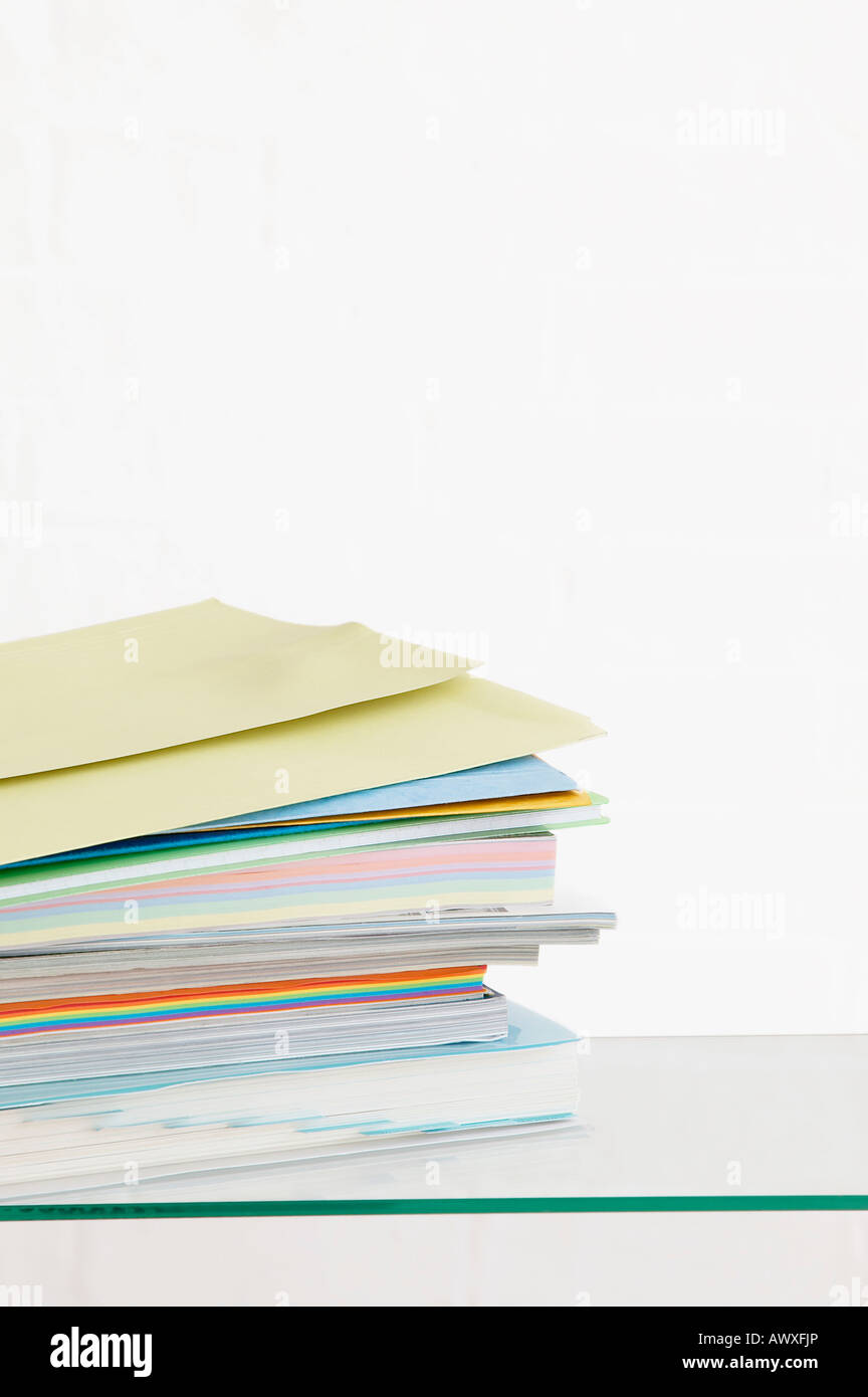 Stack of coloured stationery, studio shot Stock Photo - Alamy