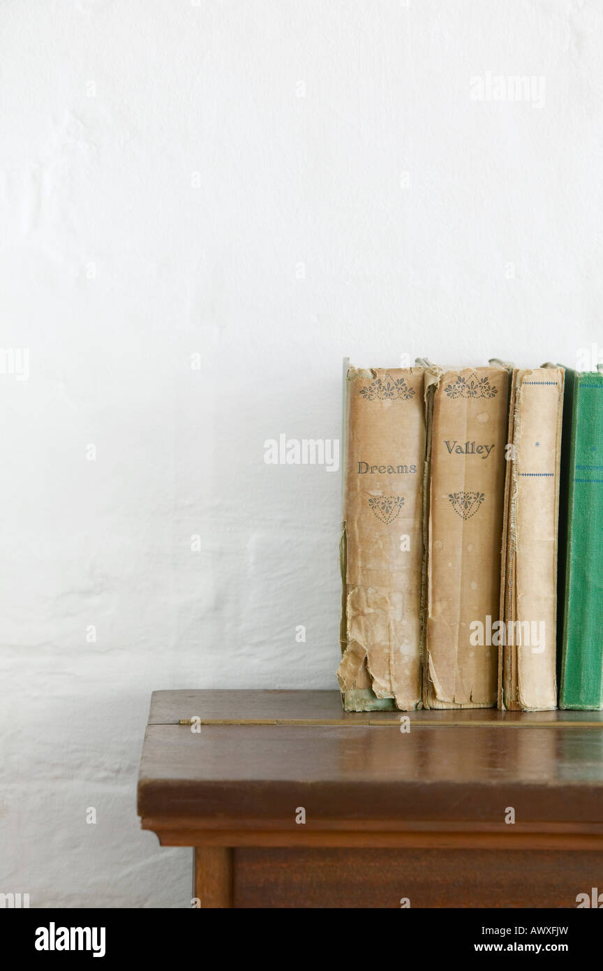Old books on wooden chest Stock Photo - Alamy