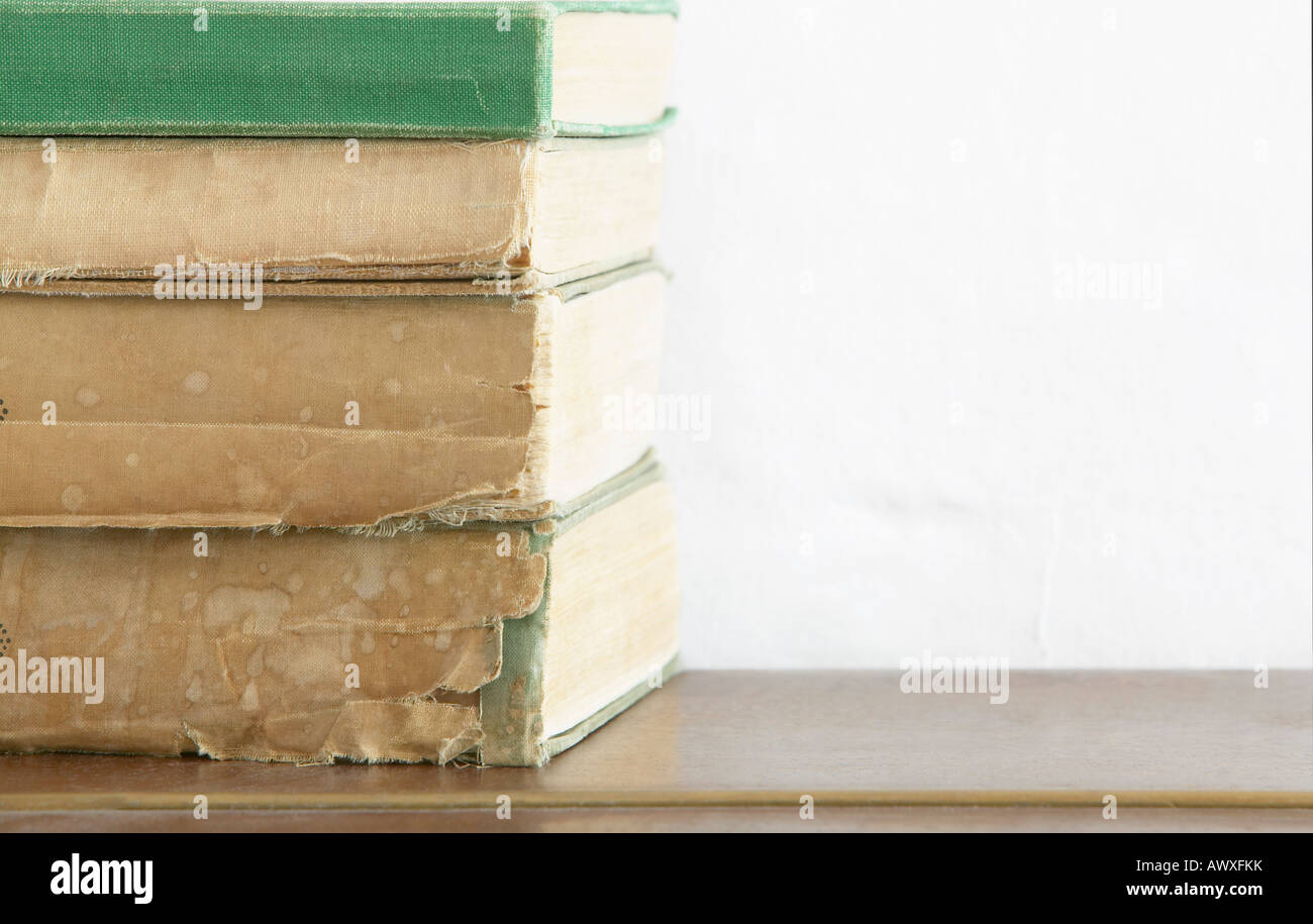 Stack of old books on wooden chest, close up Stock Photo - Alamy