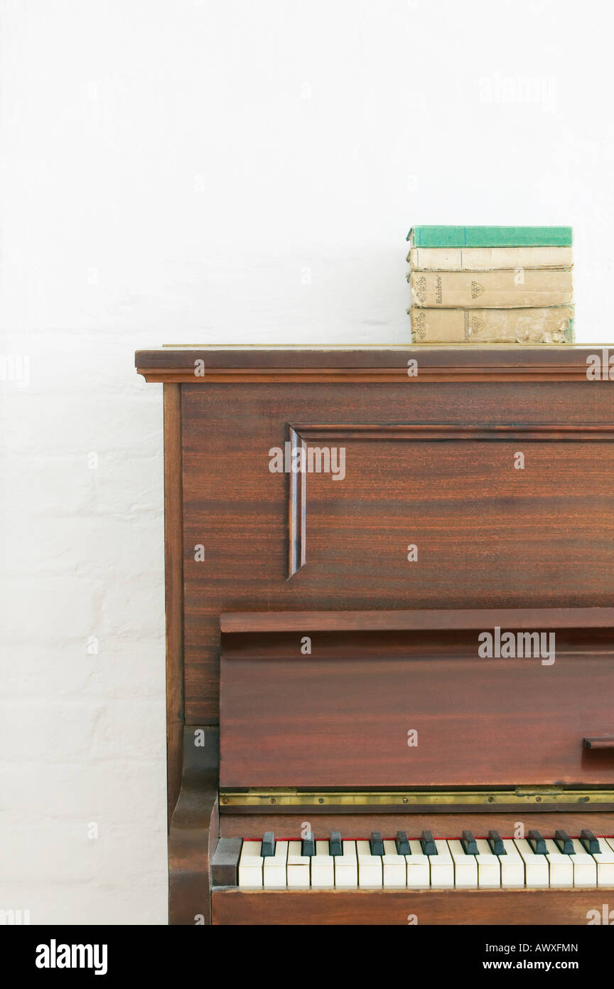 Stack of books on piano Stock Photo - Alamy