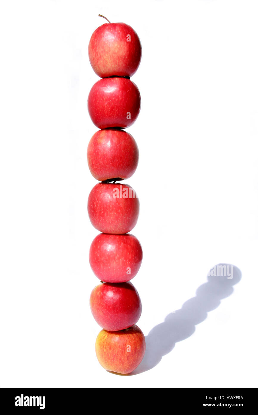 column of apples against white background Stock Photo - Alamy