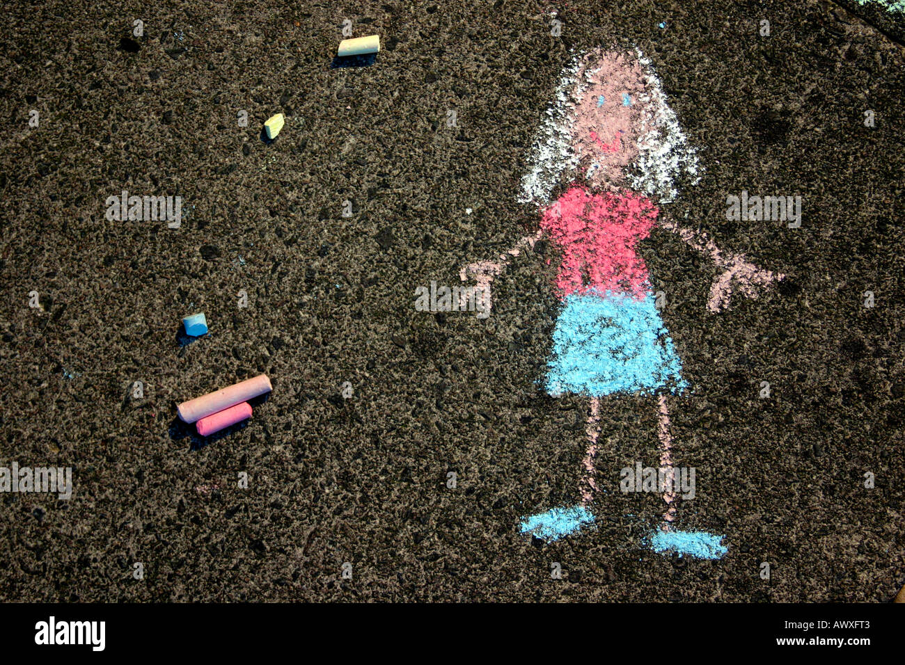 childs chalk drawing of a girl on pavement Stock Photo - Alamy