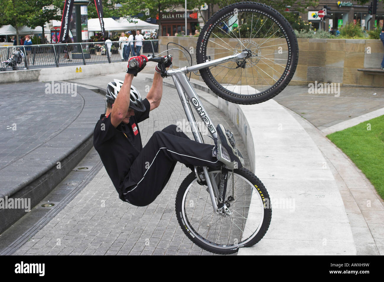 Balancing on one wheel. A cyclist performing tricks. . Piccadilly ...
