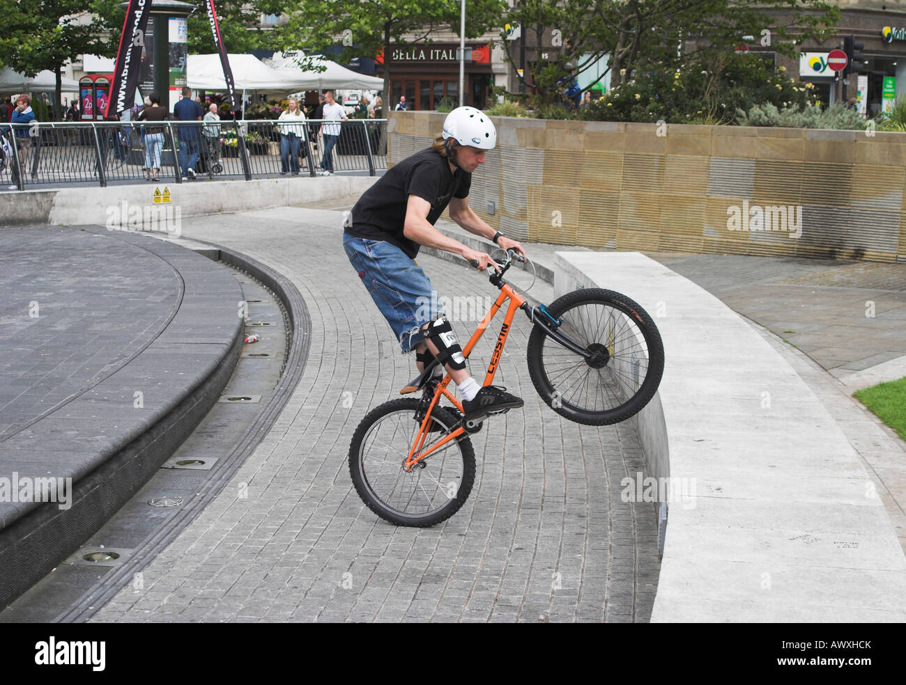 Balancing on one wheel. A cyclist performing tricks. . Piccadilly ...