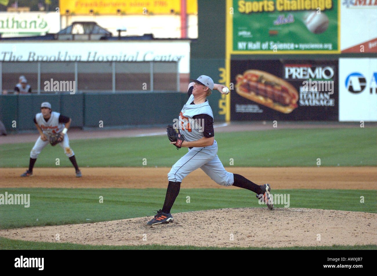 Baseball pitcher throwing a pitch towards home plate Stock Photo - Alamy