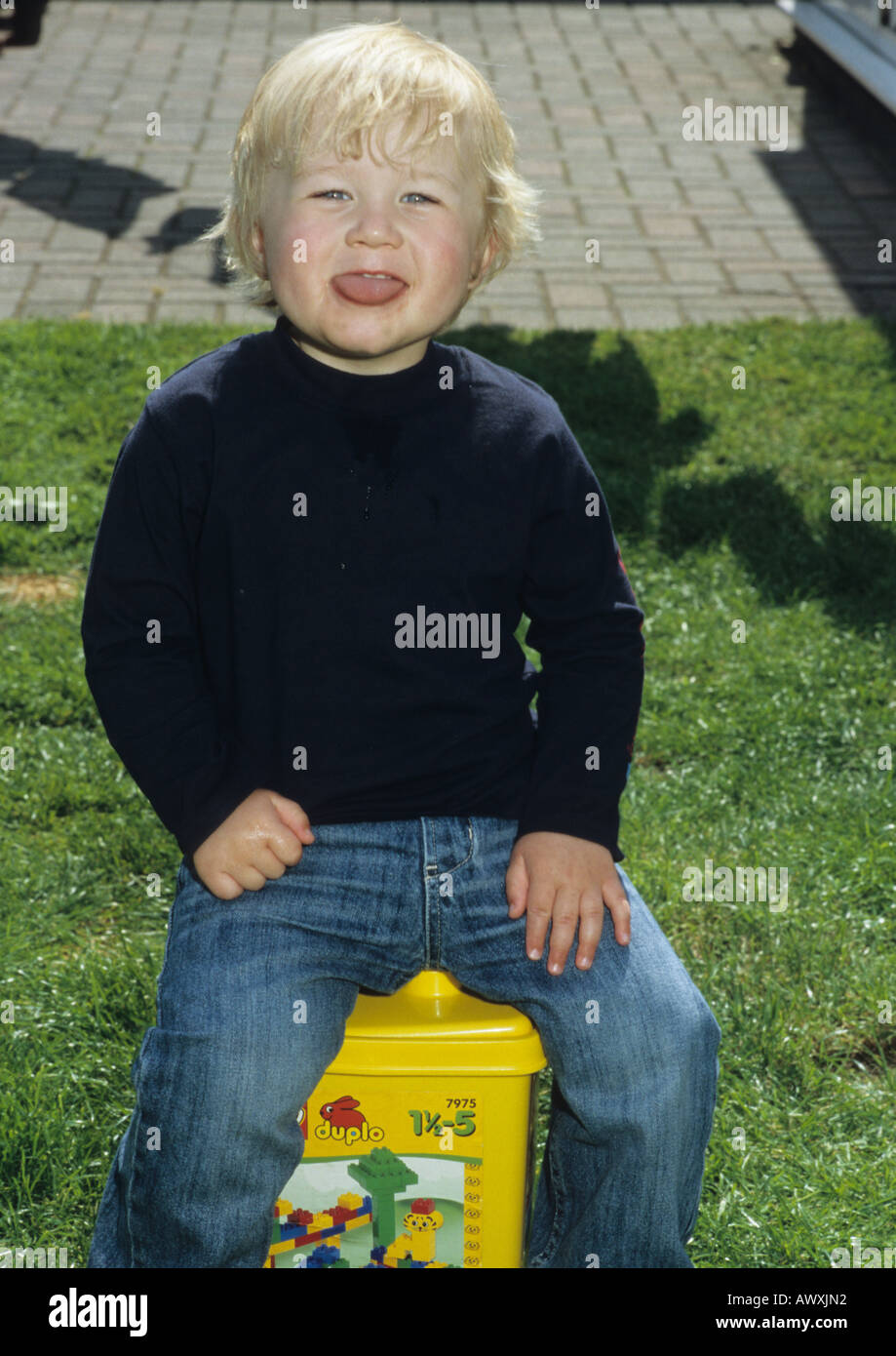 Three year old English Boy In Garden In Suffolk Uk Stock Photo - Alamy