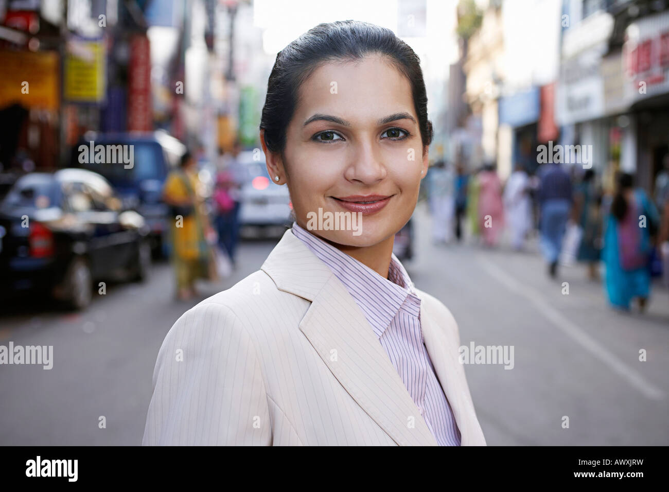 Portrait of business woman on city street Stock Photo - Alamy